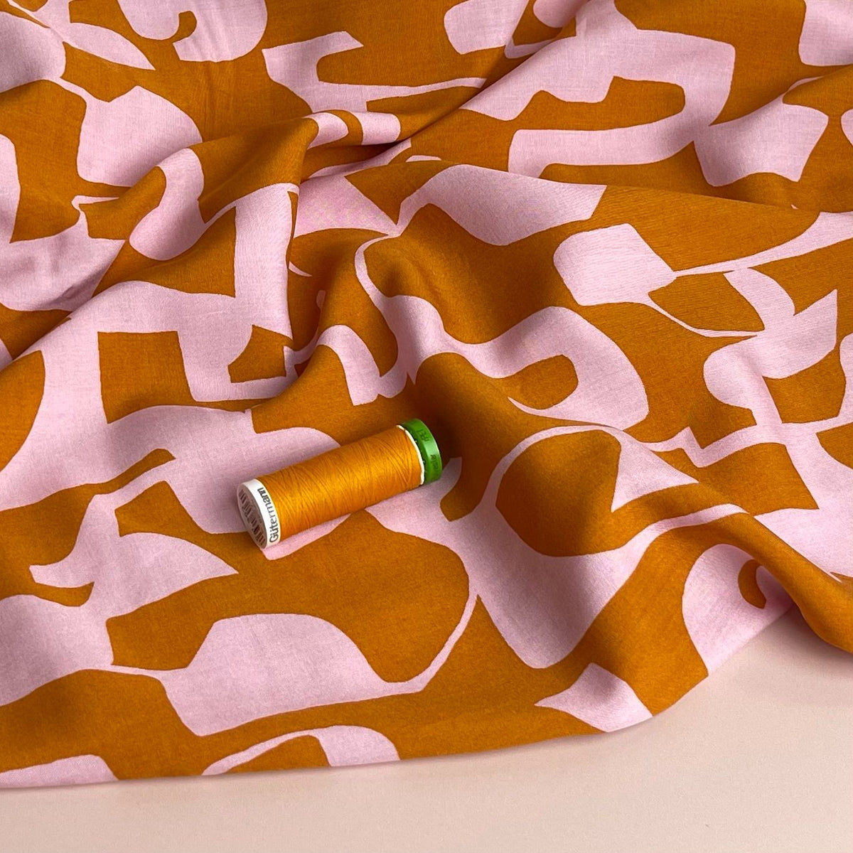 Modernist Shapes in Ochre and Pink Viscose Fabric – Lamazi Fabrics