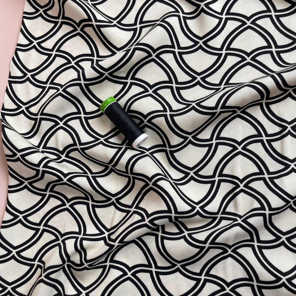 Abstract Waves on Off-White Viscose Twill Fabric – Lamazi Fabrics